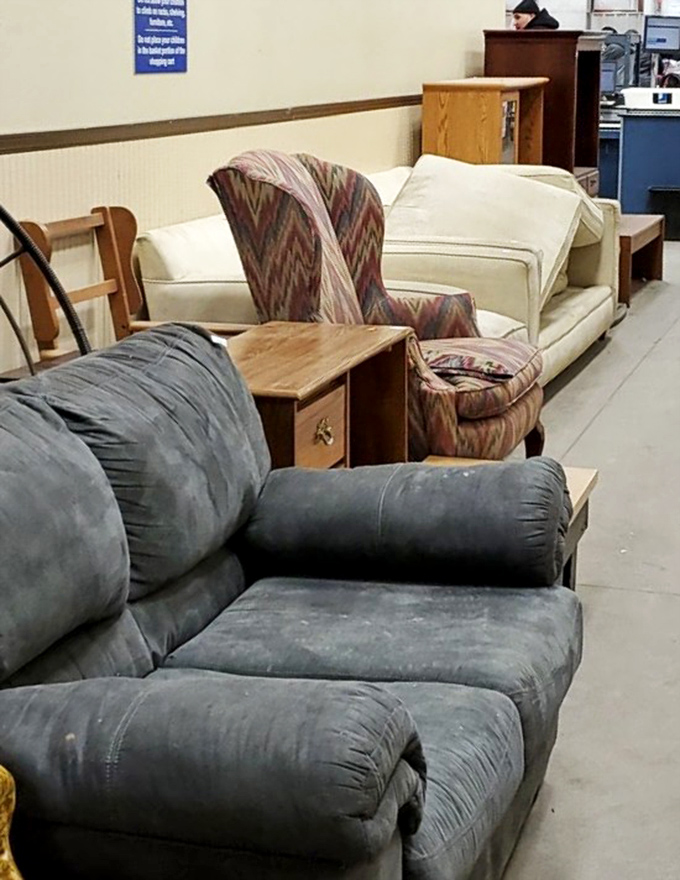 Furniture row: where sofas with stories sit patiently. That pattern on the armchair? Pure 1990s nostalgia waiting for its retro revival.