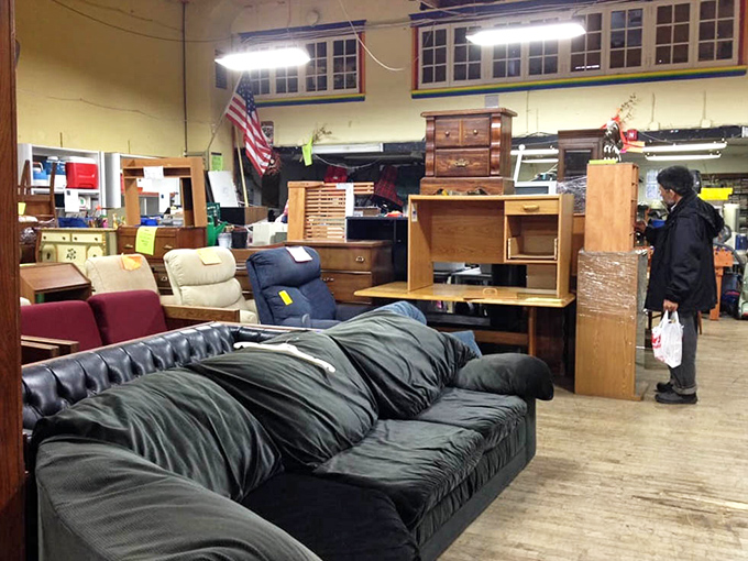 That leather sofa has seen some living, but for the price of a fancy dinner, it could be the centerpiece of your living room.