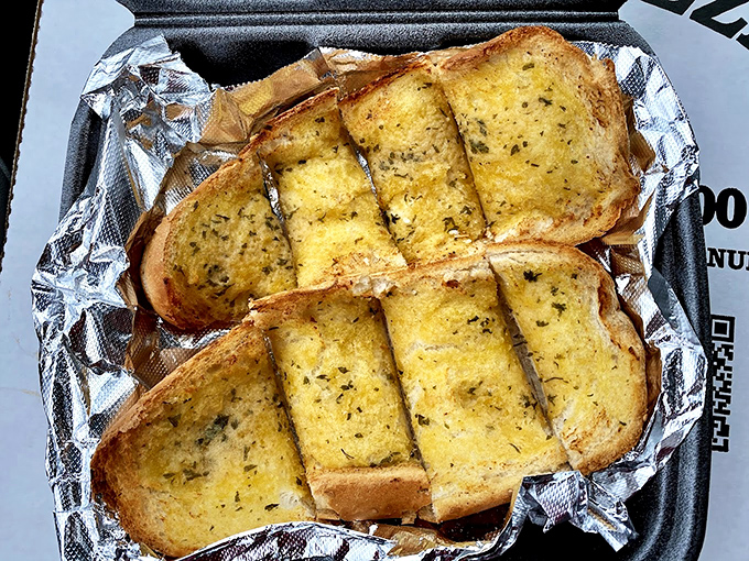 Garlic bread that could ward off vampires from three counties away. Those herbs aren't just garnish&mdash;they're a declaration of flavor intent.