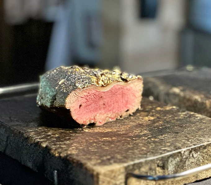 That perfect pink center surrounded by a seasoned crust isn't just steak&mdash;it's edible evidence that patience and fire create miracles.