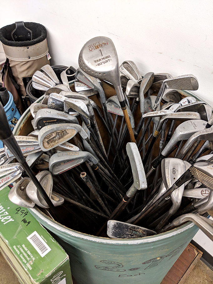 A bucket of golf clubs that proves one person's abandoned hobby is another's new passion. Tiger Woods probably started with something similar (but probably not).