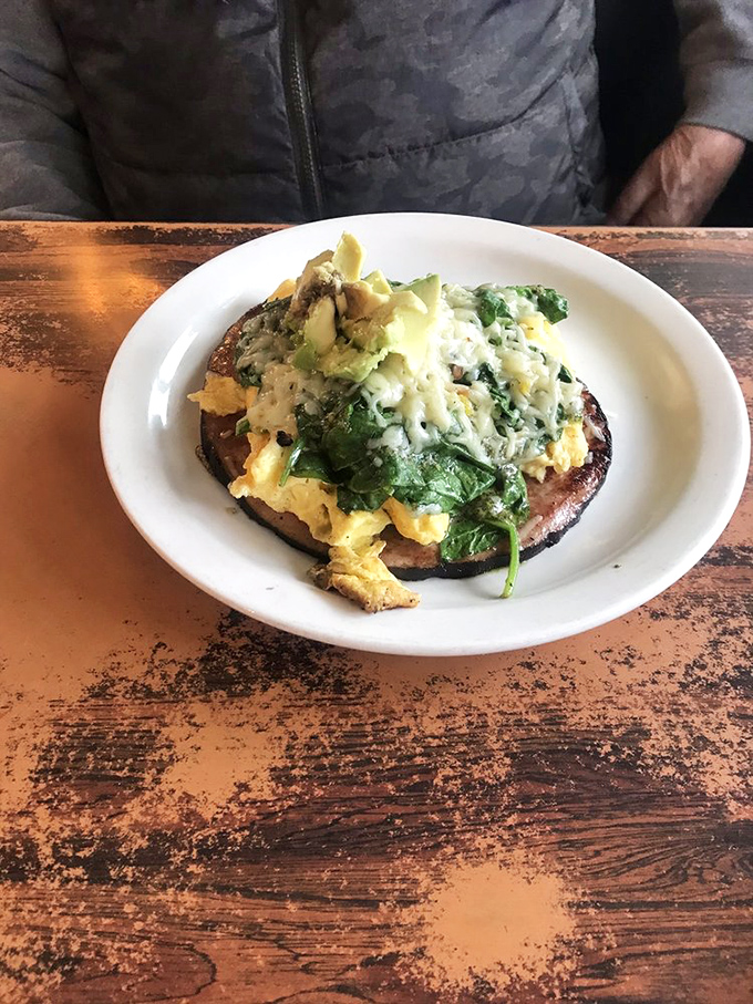 Green eggs and ham that would make Dr. Seuss proud—a whimsical breakfast creation that tastes even better than it looks.