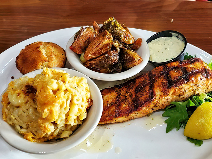 Grilled salmon keeping company with Brussels sprouts and mac and cheese &ndash; healthy meets indulgent in perfect harmony.
