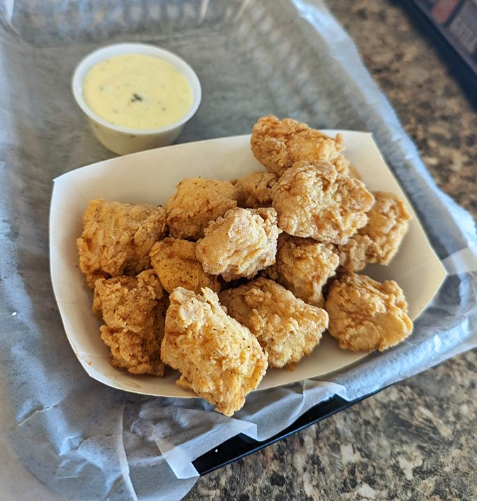 Grouper nuggets that make chicken nuggets question their life choices. One dip in that sauce and you'll understand why adults fight children for these.