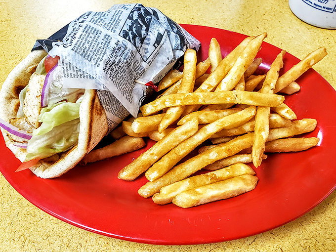 The gyro plate: where pillowy pita cradles seasoned meat while crispy fries stand at attention nearby, ready for their supporting role in this Mediterranean-Midwest fusion.