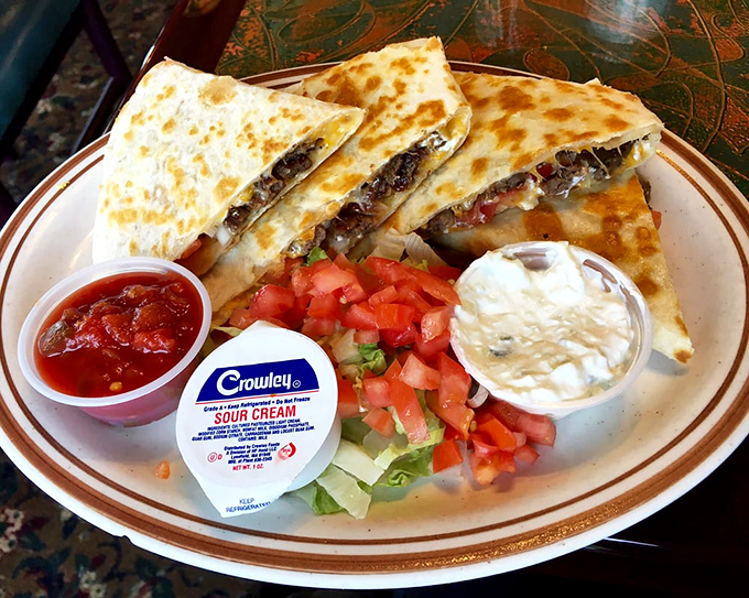 The quesadilla that proves international diplomacy can happen on a dinner plate, with sour cream as mediator.