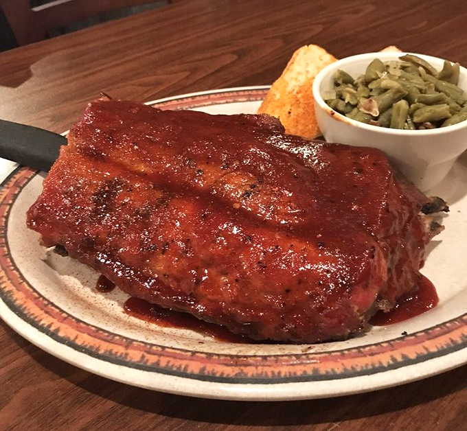 A half-rack of saucy ribs glistening under the lights like a carnivore's Christmas morning. That side of green beans is just there to make your doctor feel better.