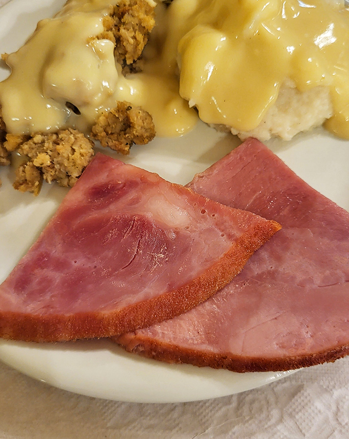 Ham, mashed potatoes, and stuffing&mdash;the holy trinity of comfort food. This plate doesn't just feed your body; it hugs your soul from the inside.