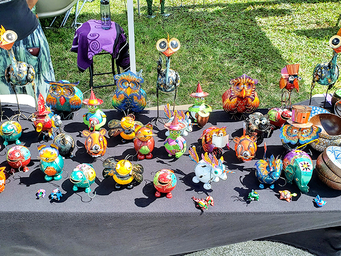 A parliament of whimsical creatures stands at attention, hand-painted personalities waiting to become conversation pieces in someone's garden.