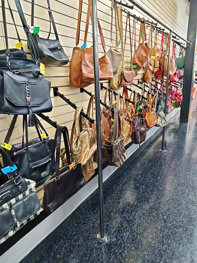 Handbag heaven hanging in perfect formation, like a leather and vinyl choir ready to sing the praises of your savvy shopping skills.