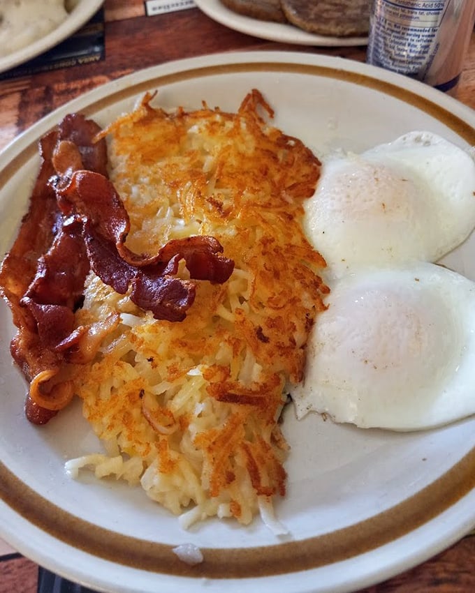 Hash browns achieving that golden-brown perfection that makes potatoes proud of their potential.