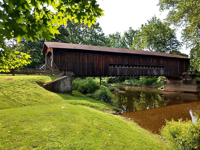 The bridge's weathered siding tells stories of countless storms weathered and seasons changed. If only wood could talk!