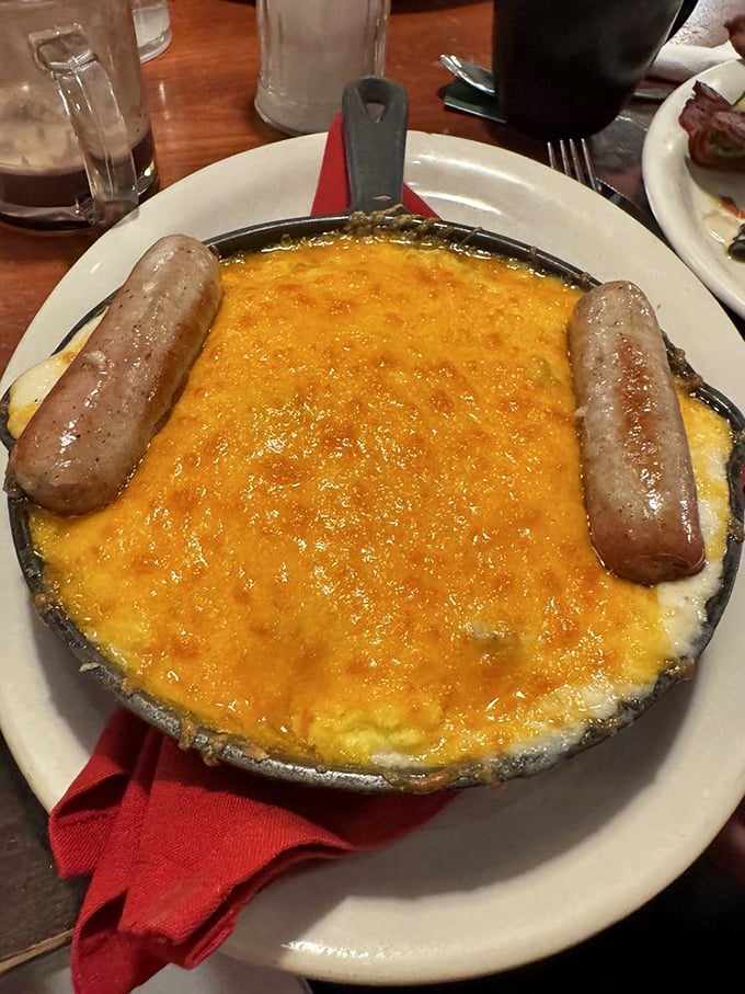 Cheese bubbling in a hot skillet with sausage standing guard. This hobo breakfast proves that humble beginnings can lead to greatness.