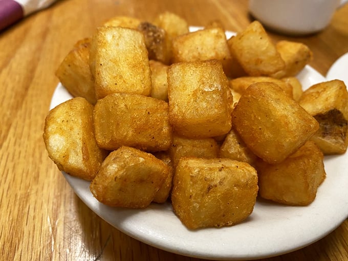 Home fries that have achieved the holy trinity: crispy exterior, fluffy interior, and seasoning that makes you wonder why potatoes ever needed ketchup.