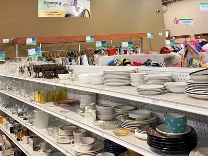 Plates, bowls, and serving pieces arranged with surprising precision. Someone's wedding registry rejects become your eclectic dinner party collection&mdash;at a fraction of department store prices.