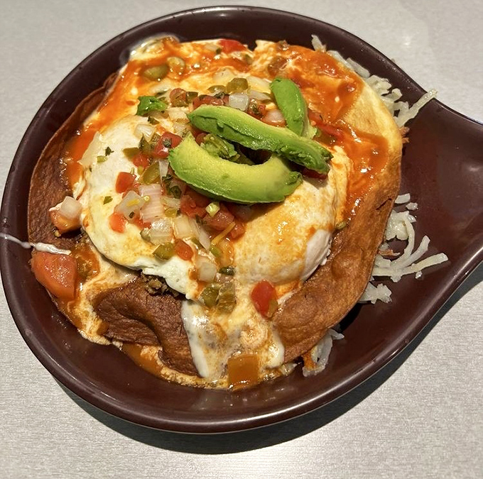 This huevos rancheros skillet delivers eggs, avocado, and enough delicious toppings to make your taste buds stand up and salute.