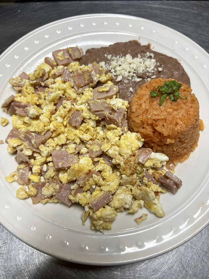 Huevos con jam&oacute;n&mdash;where fluffy scrambled eggs meet savory ham in a breakfast romance that's stood the test of time for good reason.