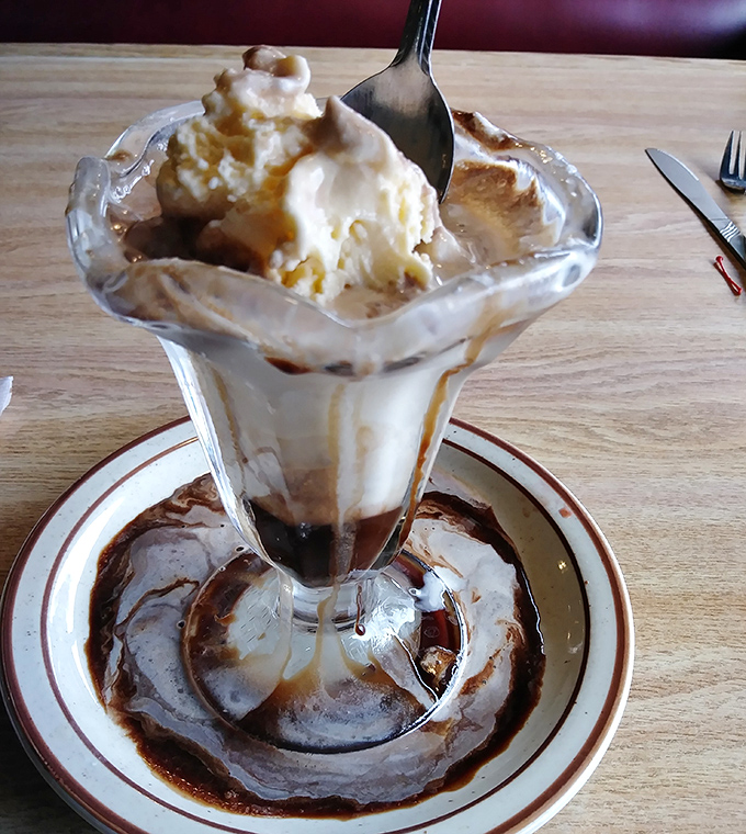 Ice cream sundae or edible art installation? Either way, that hot fudge is performing gravity-defying feats worthy of a Vegas show.