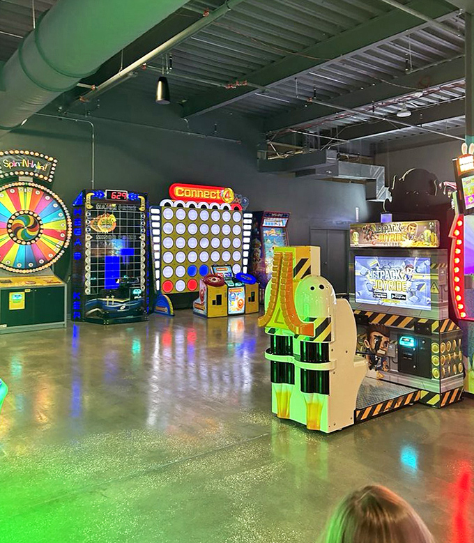 Giant Connect Four and spinning prize wheels prove that sometimes the simplest games deliver the purest joy, especially when bathed in alien-green lighting.