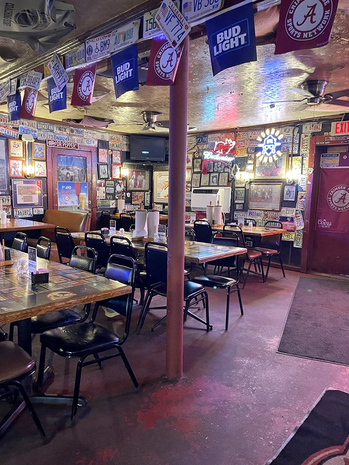 The walls tell stories that words can't: Alabama football, license plates, and decades of memories create Dreamland's unique atmosphere.