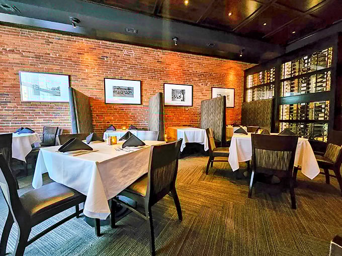Another dining room where exposed brick and thoughtful lighting create an atmosphere that says, "Stay awhile, the outside world can wait."