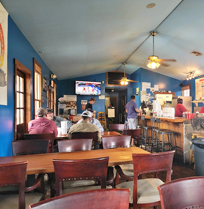 The counter seating isn't just functional&mdash;it's front-row tickets to the greatest show on earth: watching barbecue masters at work.