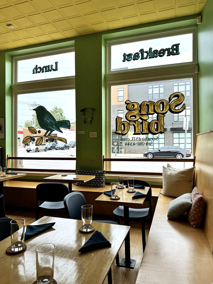 Large windows flood the space with natural light, making this cozy corner the perfect spot to linger over that second cup of coffee.