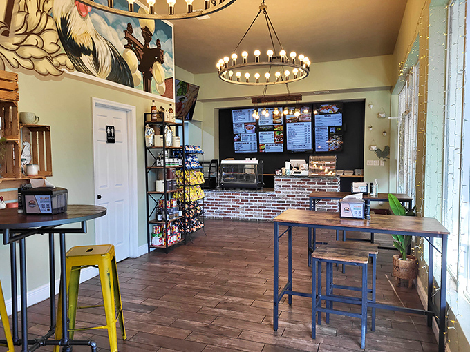 Industrial-chic meets Florida casual with wooden shelving, yellow stools, and enough plants to make your neglected houseplants jealous.