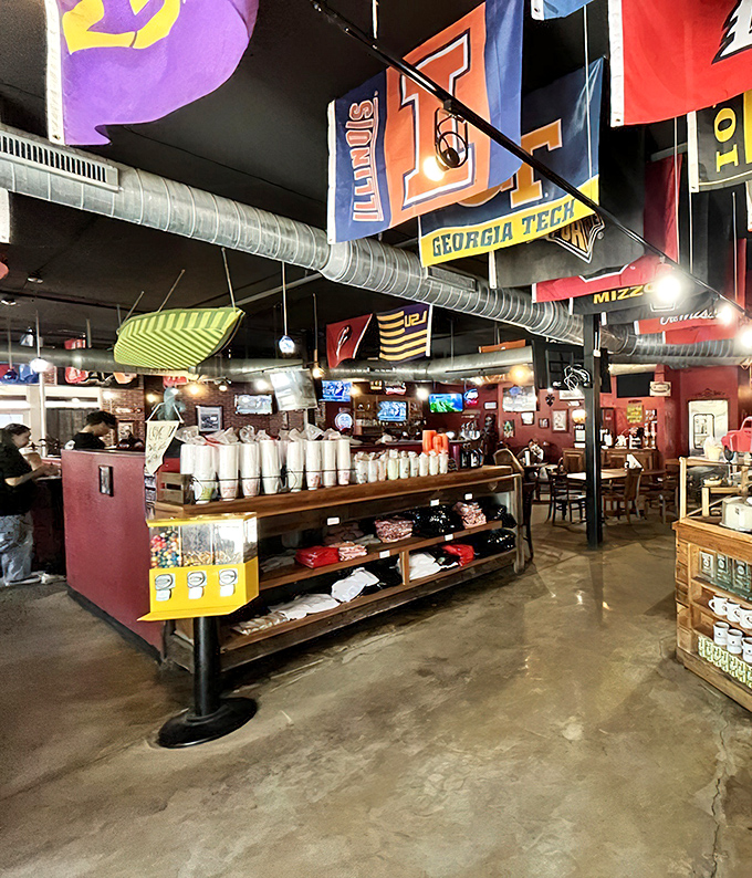 Sports memorabilia and exposed ductwork create that perfect casual vibe where nobody judges your second helping.