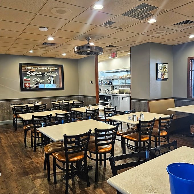 Wood tones, simple lighting, and a glimpse into the kitchen—Chris' dining room says, "We're not here for the Instagram likes; we're here for the food."