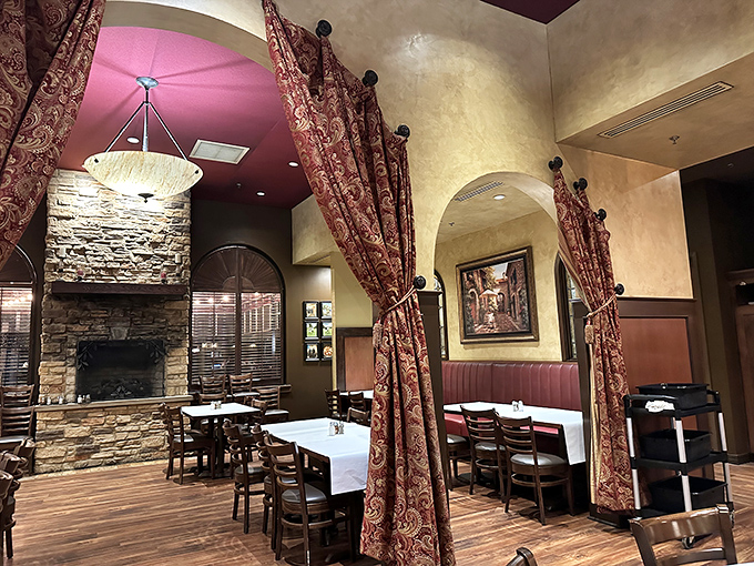 The stone fireplace anchors the dining room like a warm hearth in an Italian country home &ndash; minus the distant cousin who won't stop talking politics.