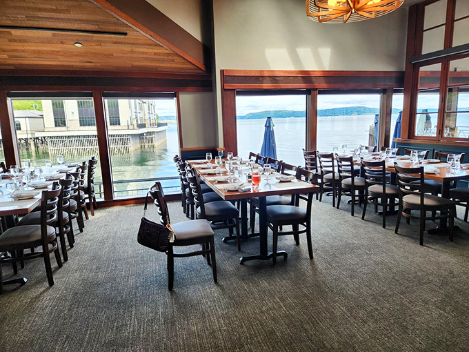 Floor-to-ceiling windows frame Commencement Bay like living paintings that change with every passing cloud and boat.