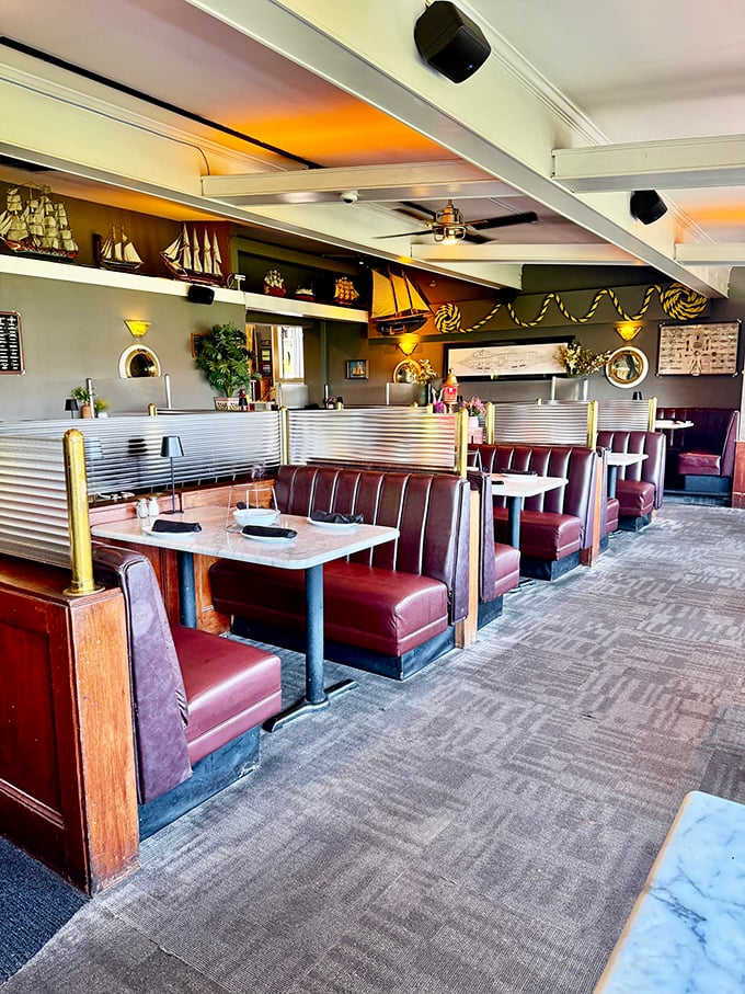 Rich burgundy booths and nautical touches create the perfect balance of comfort and class &ndash; like a ship captain's quarters redesigned for people who actually enjoy eating.