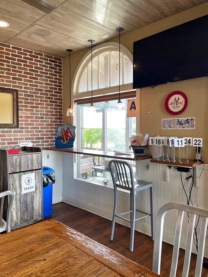 Nautical chic meets casual comfort with those arched windows and porthole-inspired wall d&eacute;cor. The perfect backdrop for seafood storytelling.