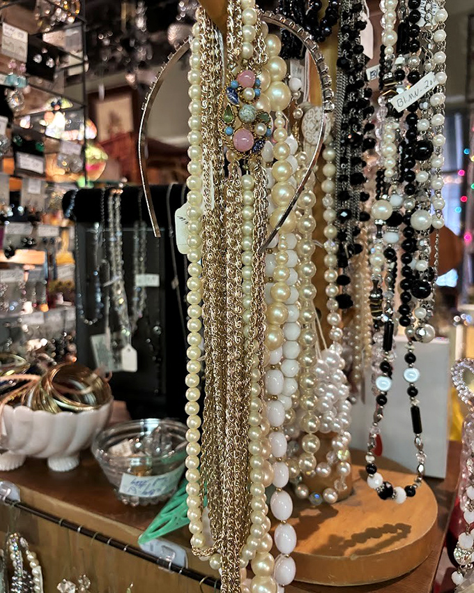 Pearls and chains cascade like elegant waterfalls of nostalgia&mdash;jewelry that once adorned someone's special night out, now waiting for its next adventure.