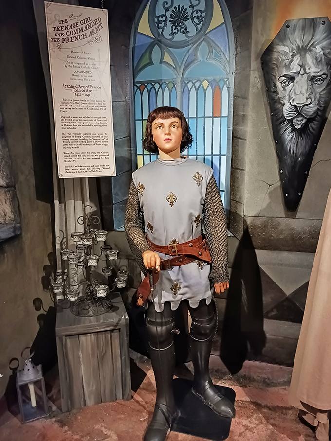Joan of Arc stands battle-ready in her medieval armor, a reminder that some teenage rebellions involved liberating France rather than skipping homework.