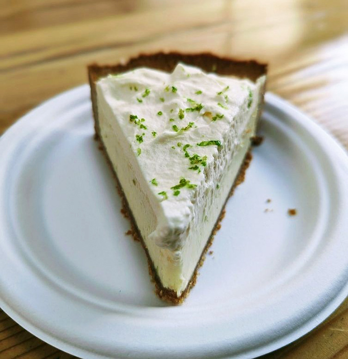Key lime pie that strikes the perfect balance between sweet and tart. That sprinkle of zest on top is like the perfect punchline to a dessert joke.