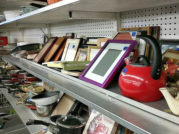 Picture frames and teakettles living in harmony. That red kettle is just begging to whistle on your stovetop tomorrow morning.