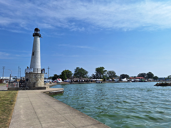 The lighthouse stands guard over Grand Lake St. Marys, a beacon for boaters and an irresistible backdrop for every visitor's obligatory selfie.