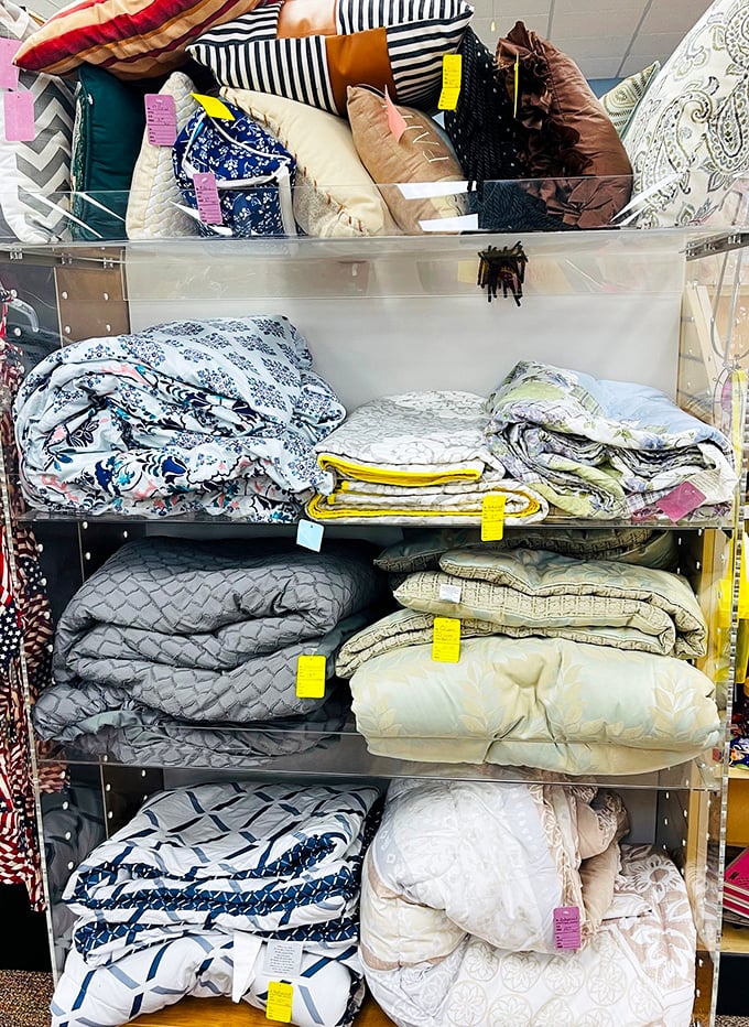 The linen section: where comforters with plenty of comfort left to give await their second chance at making a bedroom beautiful.