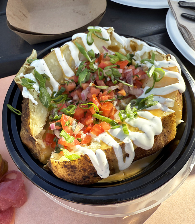 A loaded potato that's dressed for the barbecue prom. Sour cream, cheese, and toppings dancing atop a smoky spud.