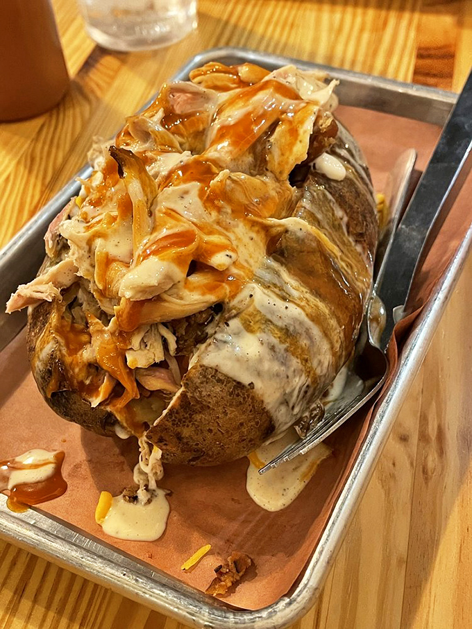 Not just any potato&mdash;a smoke-infused vessel carrying pulled chicken, sauce, and dreams. Spuds have never had it so good. 