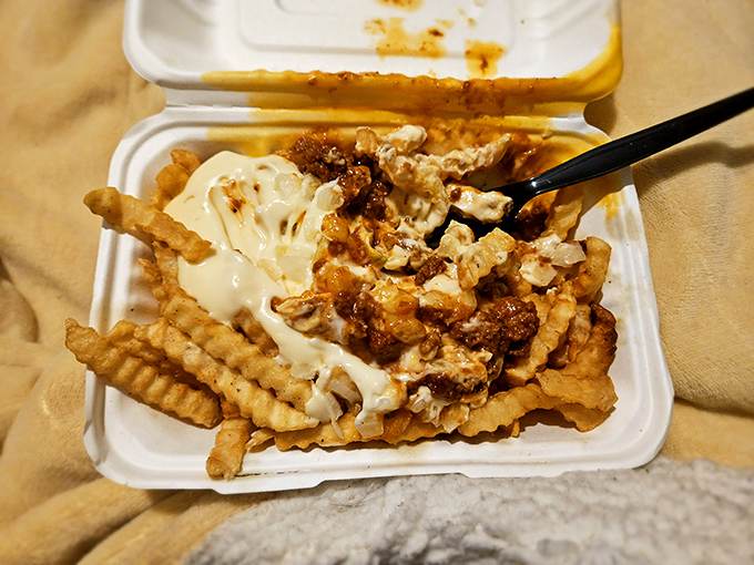 These aren't just loaded fries&mdash;they're a masterpiece of excess. That cheese sauce flows like lava over a landscape of perfectly crisp potatoes.