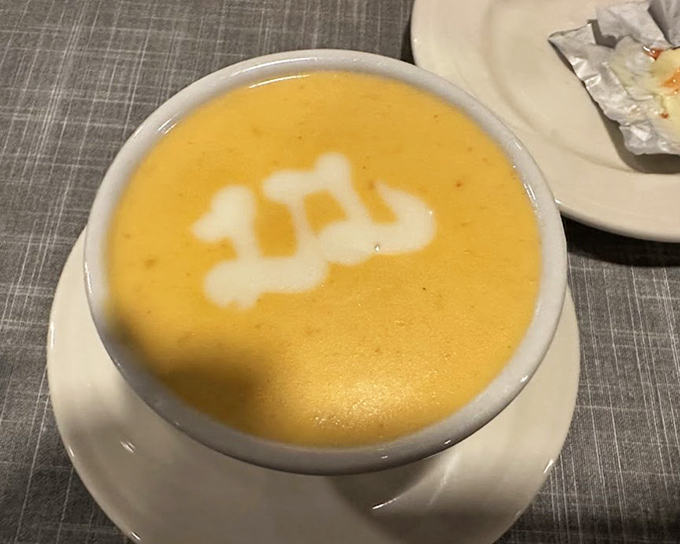 Lobster bisque with a decorative cream swirl that says, "Yes, I'm fancy, but I'm also about to make you incredibly happy."