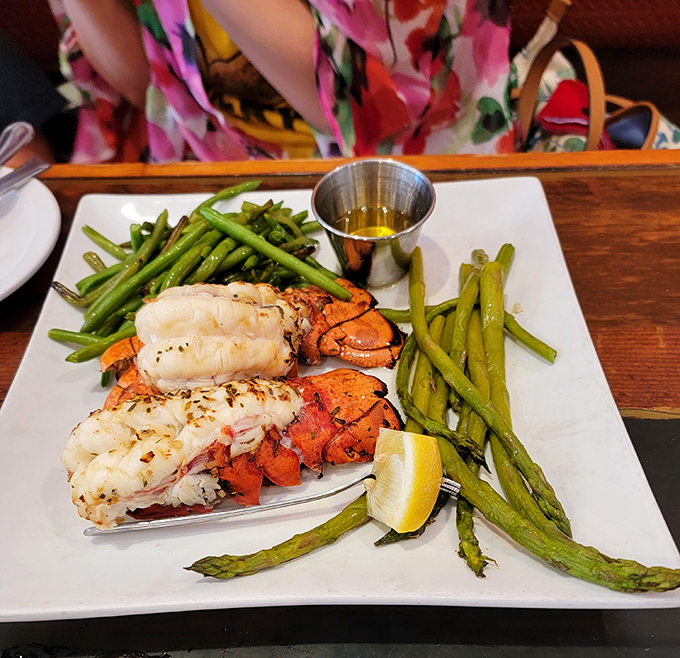 Lobster tails with asparagus—nature's way of saying "you deserve this." The drawn butter is basically liquid sunshine.