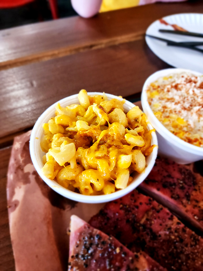 Mac and cheese that glows like liquid gold &ndash; a creamy, cheesy side dish that refuses to be overshadowed by its meaty companions.