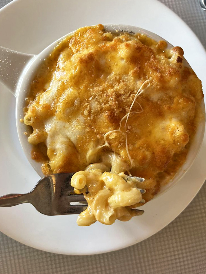 Mac and cheese that's achieved the perfect golden crust &ndash; the kind that makes you want to break through it like a cr&egrave;me br&ucirc;l&eacute;e.
