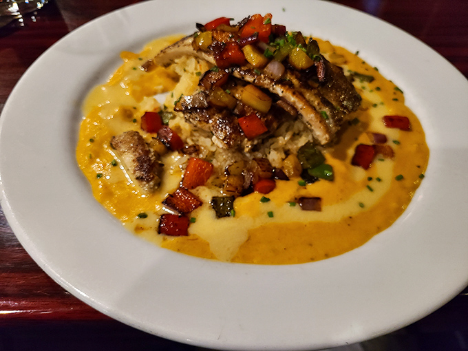 Mahi-mahi perched atop creamy risotto with colorful vegetables—like a tropical vacation that somehow landed on your dinner plate in Pennsylvania.