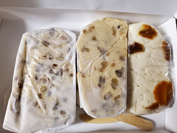 Three slabs of fudge that should require a permit to possess. White chocolate, nuts, and caramel swirls &ndash; the holy trinity of indulgence.