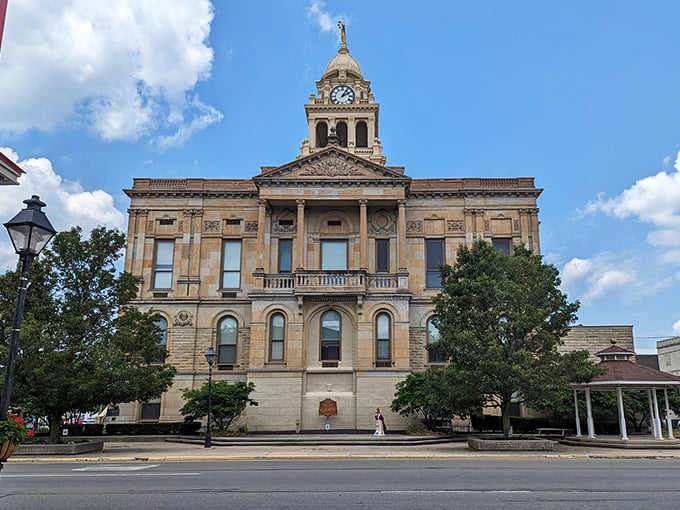 The Marion County Courthouse stands as a limestone testament to small-town grandeur, its clock tower keeping time for generations of residents.